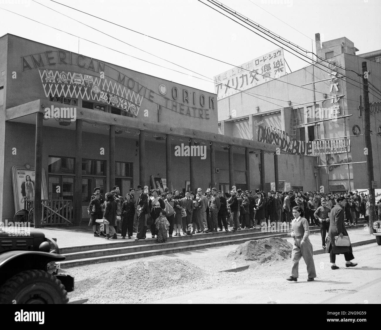 Long lines are seen outside the newly opened Orion theater in Tokyo ...
