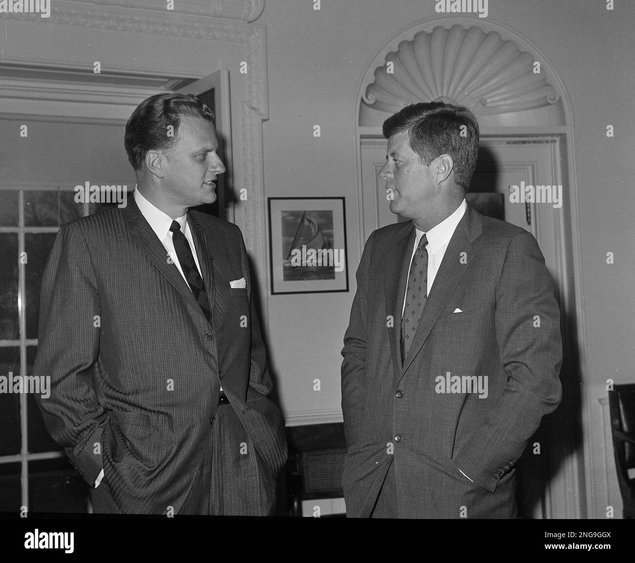 Evangelist Billy Graham, left, talks with President John F. Kennedy ...