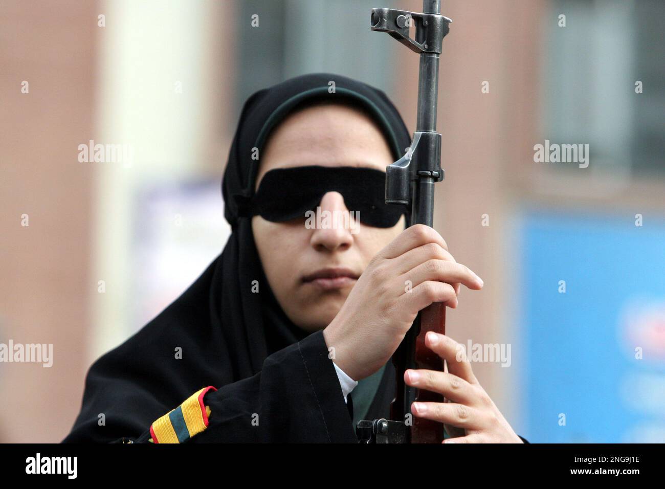 With her eyes covered a Iranian female police officer, assembles and ...