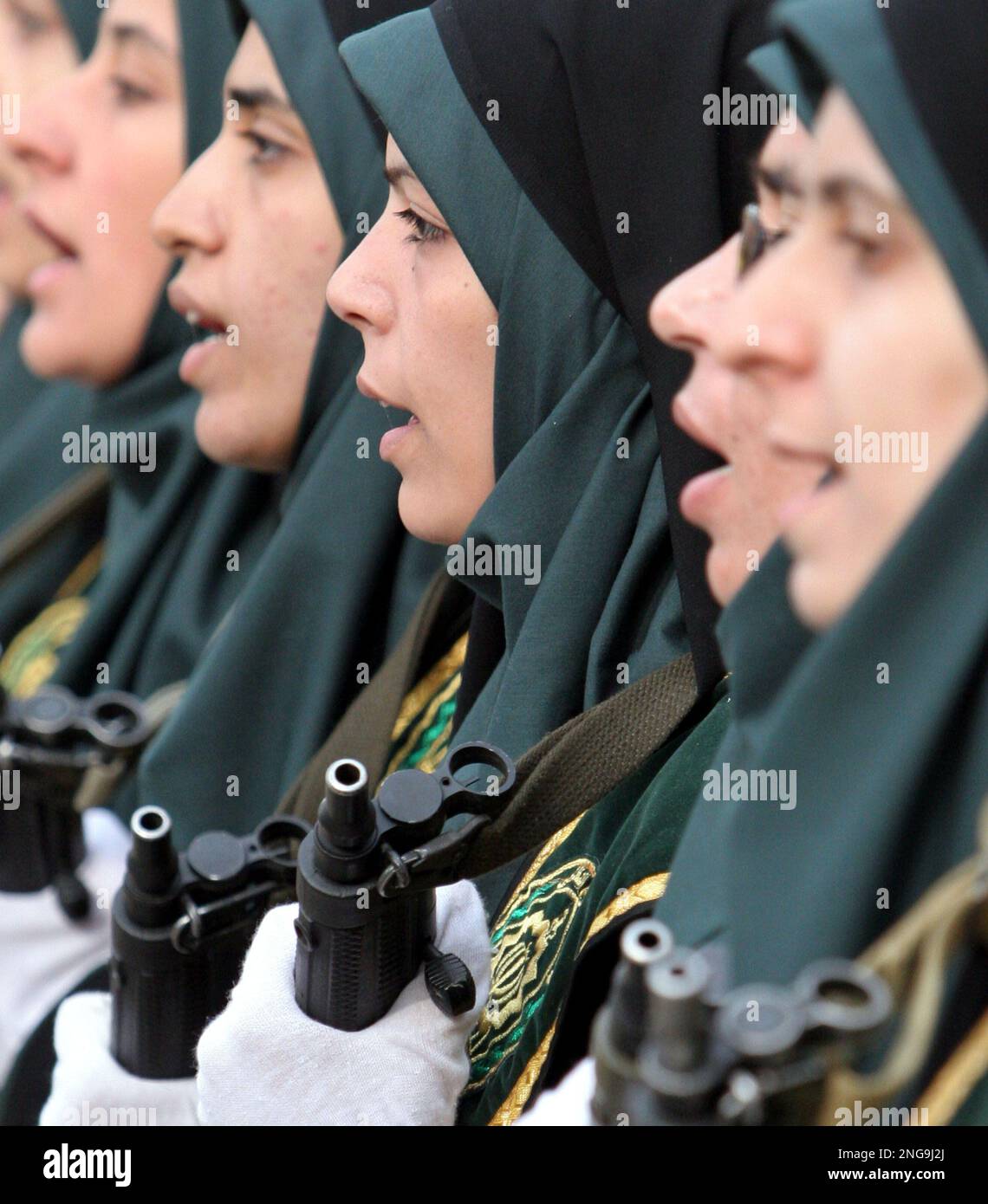 Iranian female police officers wearing chadors chant Islamic slogans ...