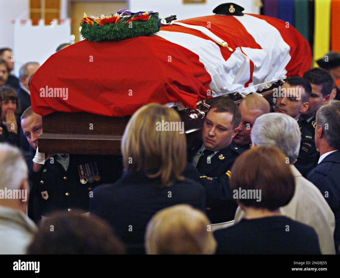 The body of Cpl. Paul Davis is carried from Knox United Church by ...