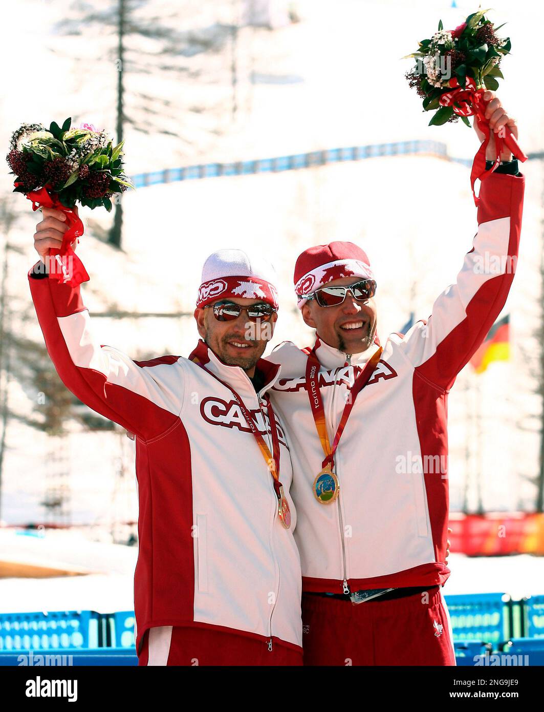 Canada's Brian McKeever, left, with his guide Robin McKeever, celebrate ...
