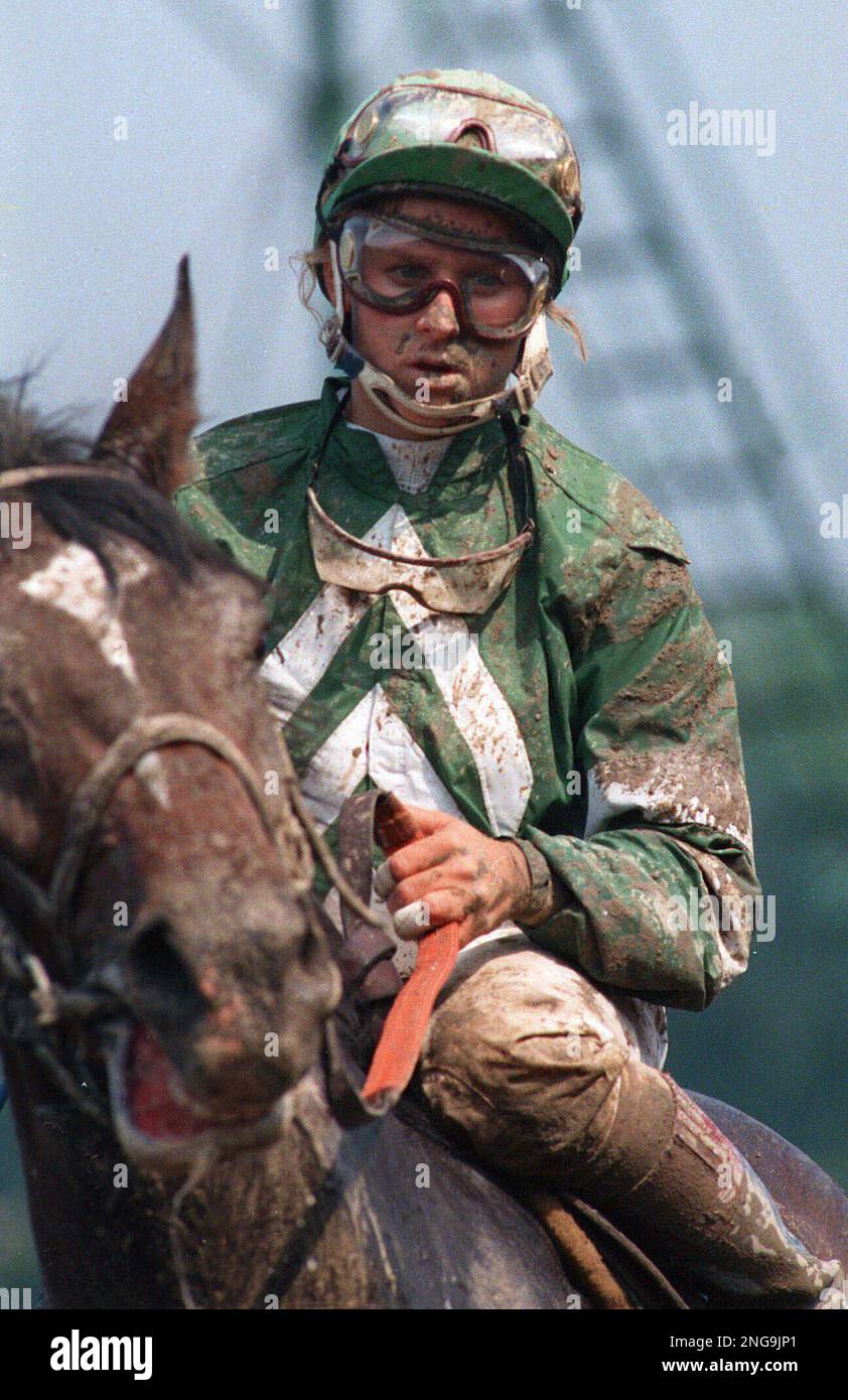 Jockey Julie Krone is covered with mud after a race at Monmouth Park in ...