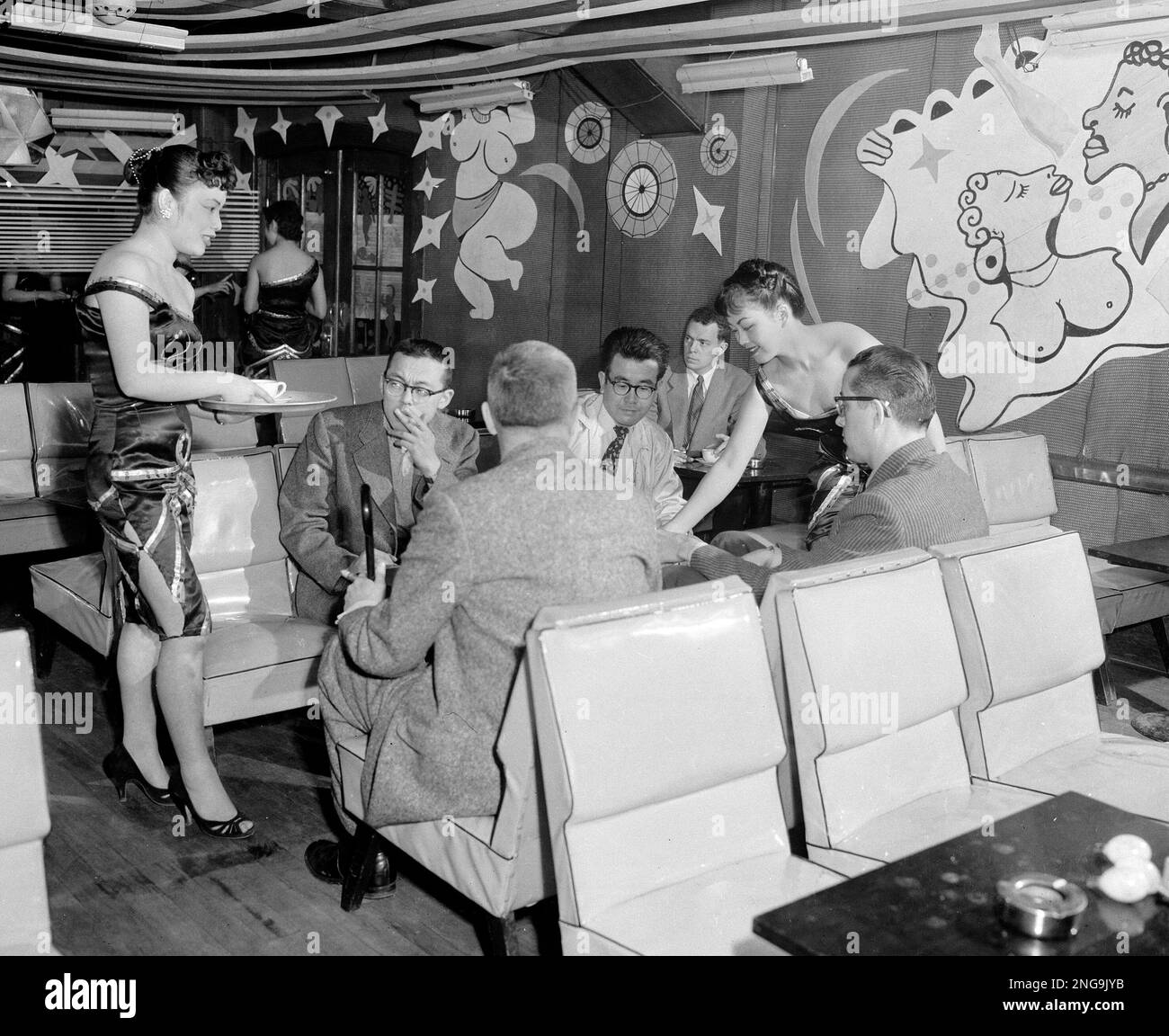 Japanese businessmen are waited on at the Albion Cafe in Tokyo, Oct. 1 ...