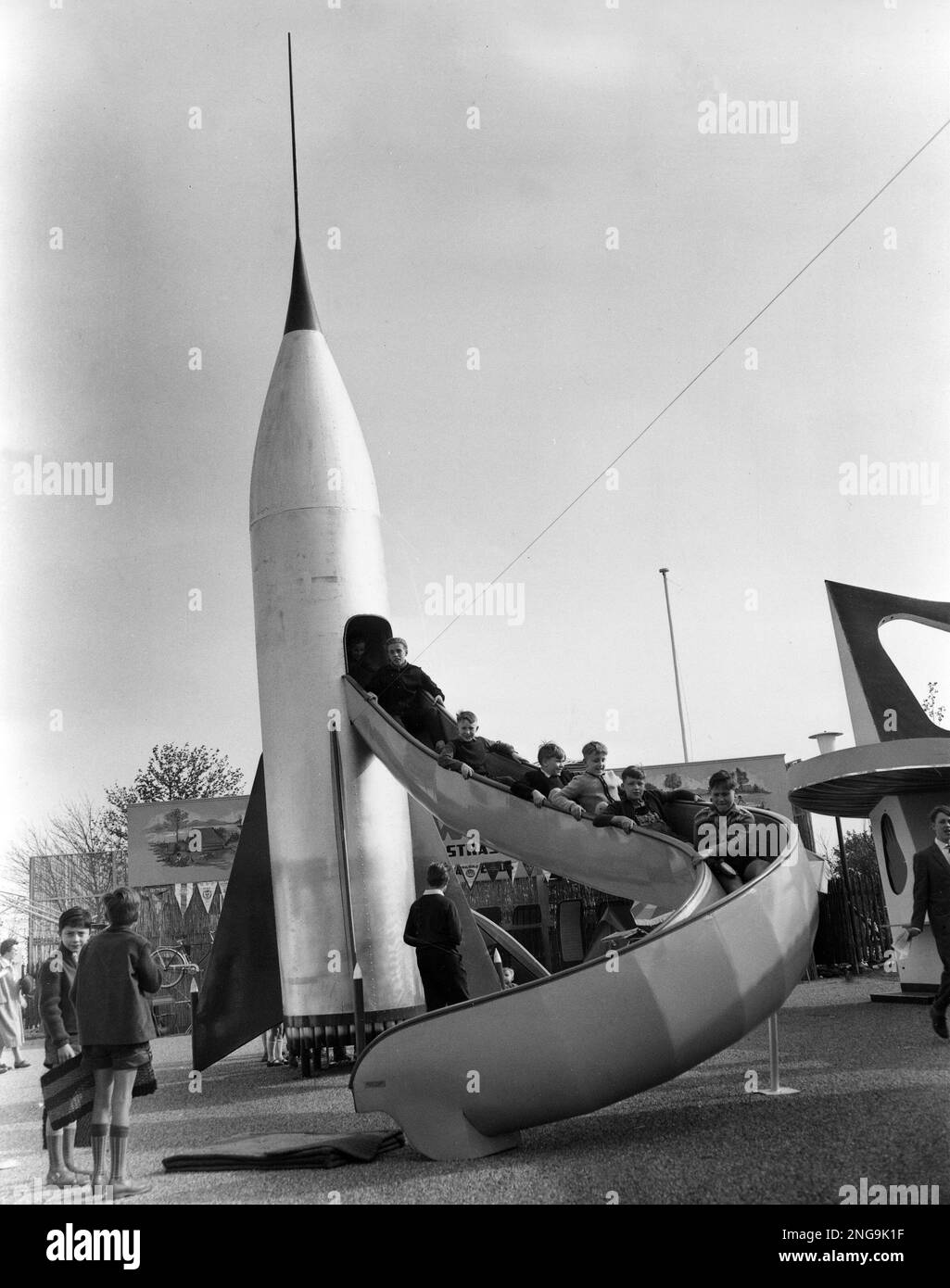 Children play on a rocket ship slide in Dortmund, Germany, May 25, 1959 ...