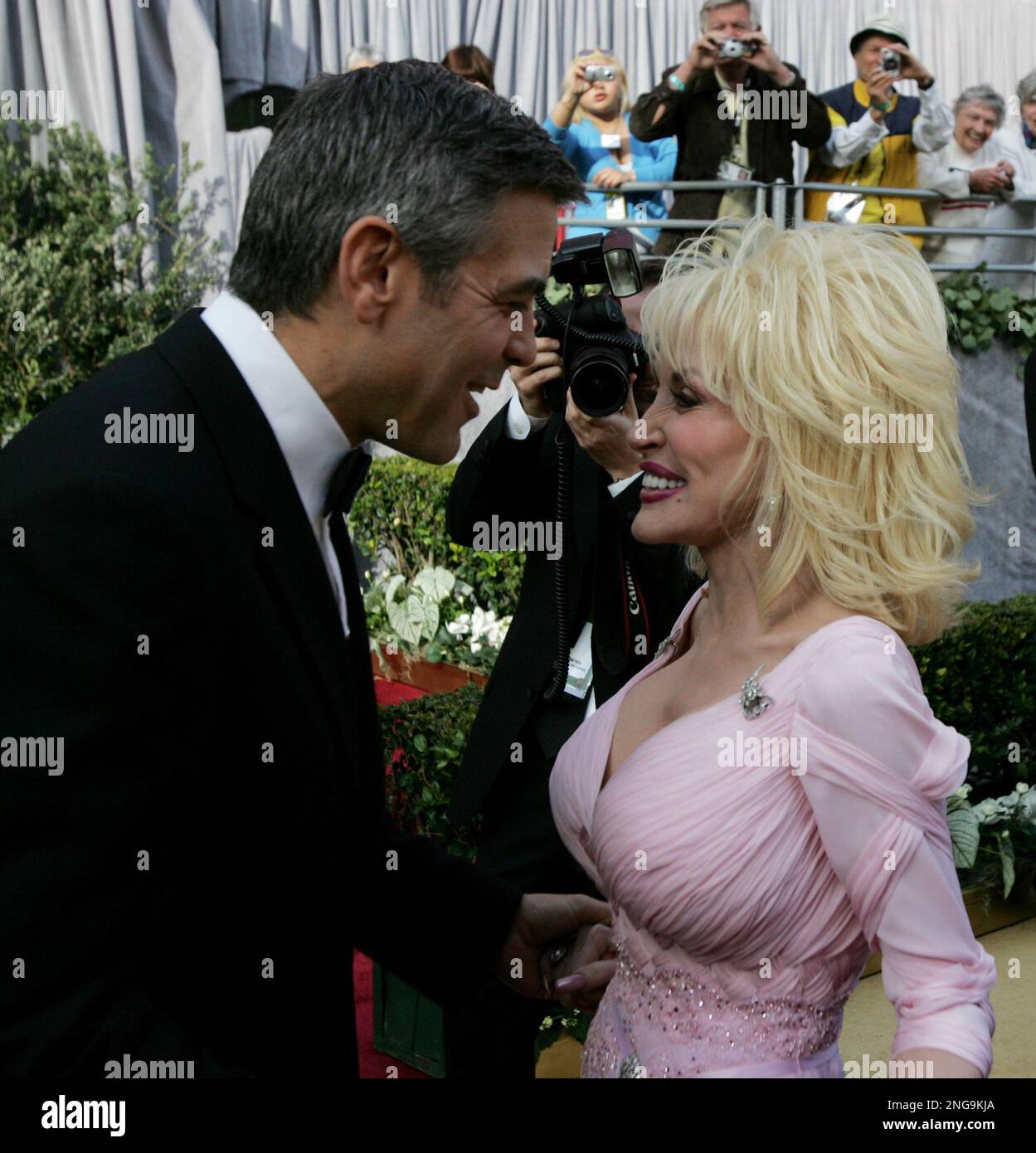 Singer Dolly Parton and Actor and Director George Clooney talk while ...