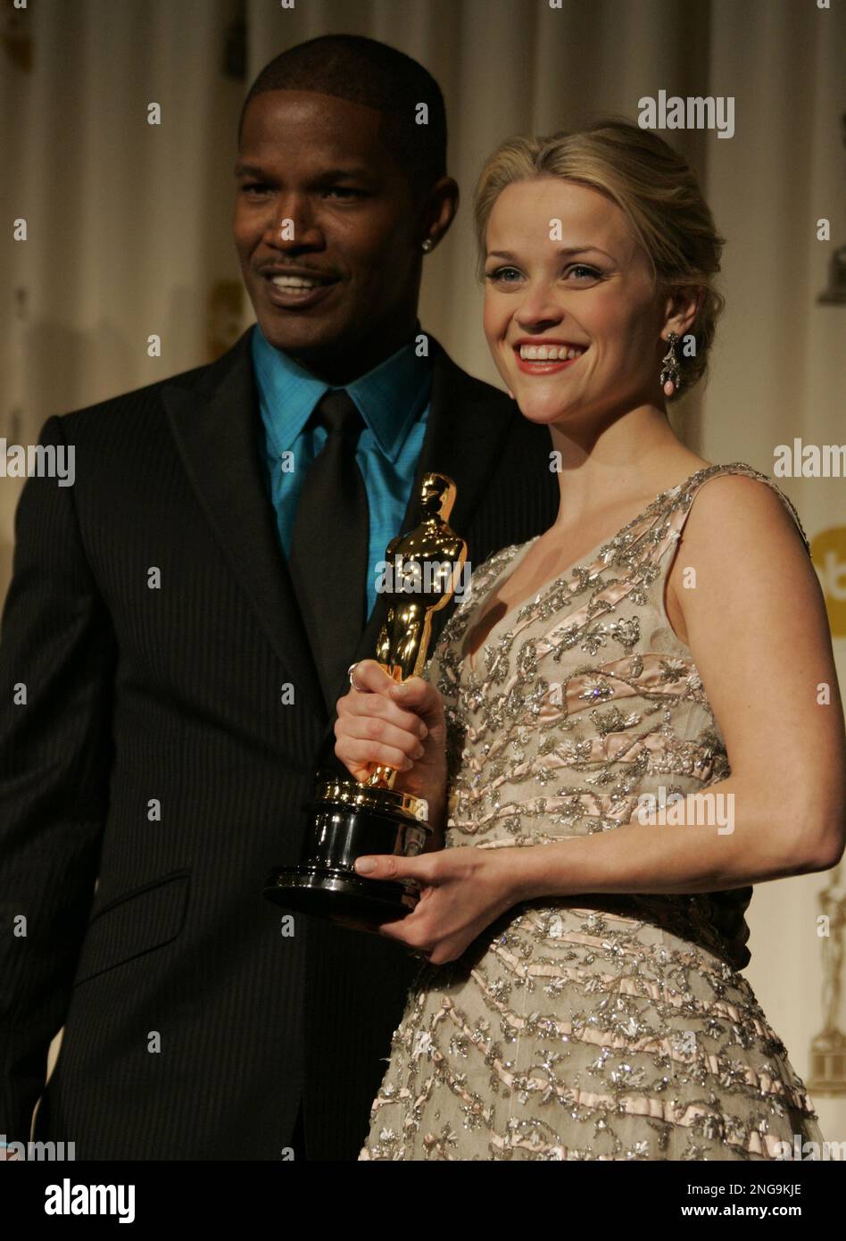 Reese Witherspoon holds her Oscar for best actress for her role in ...