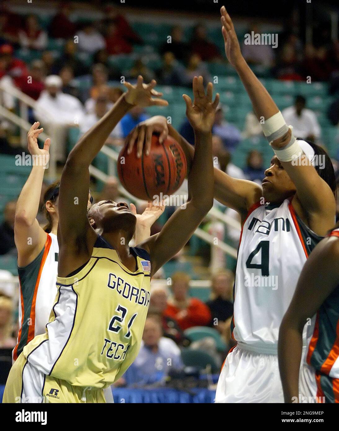Georgia Tech's Janie Mitchell (21) has her shot blocked by Miami's ...