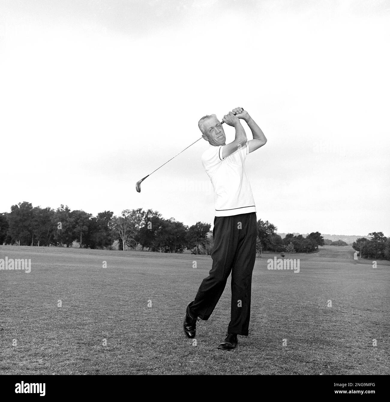 Pro golfer Harvey Penick shown during a posed swing at the Austin ...