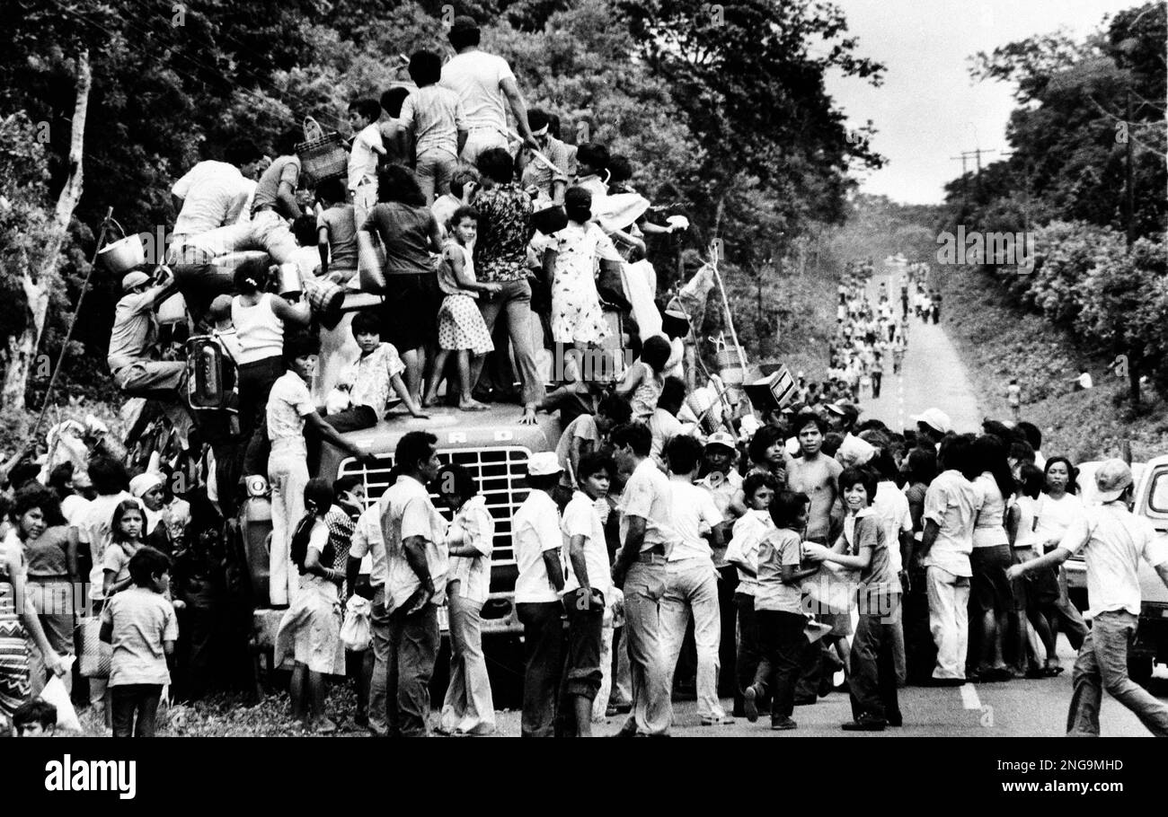 Hoards of people mob a truck loaded with food Friday June 29, 1979 on ...