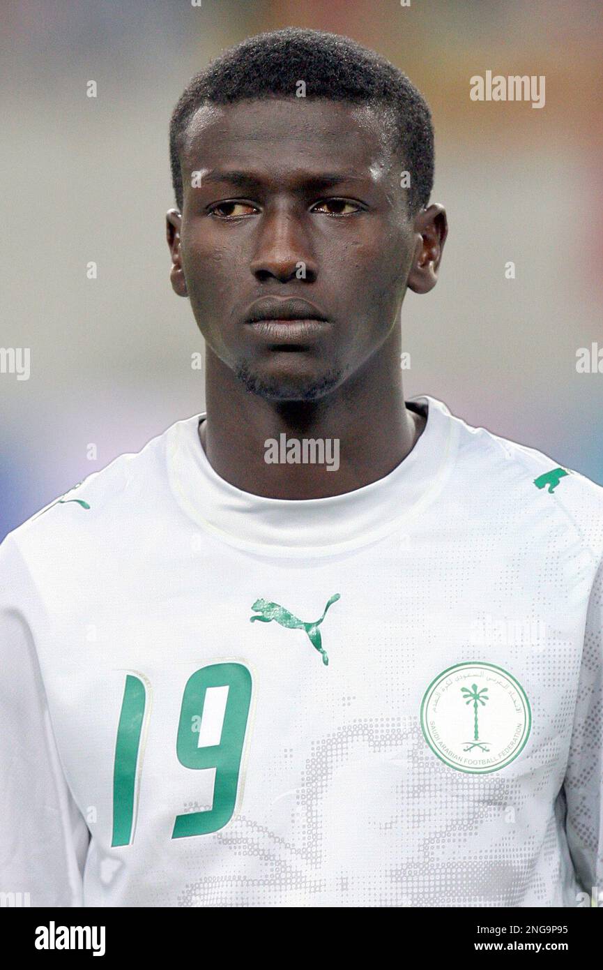 Mohammed Massad Al Mowallad of Saudi Arabia listens to the national ...