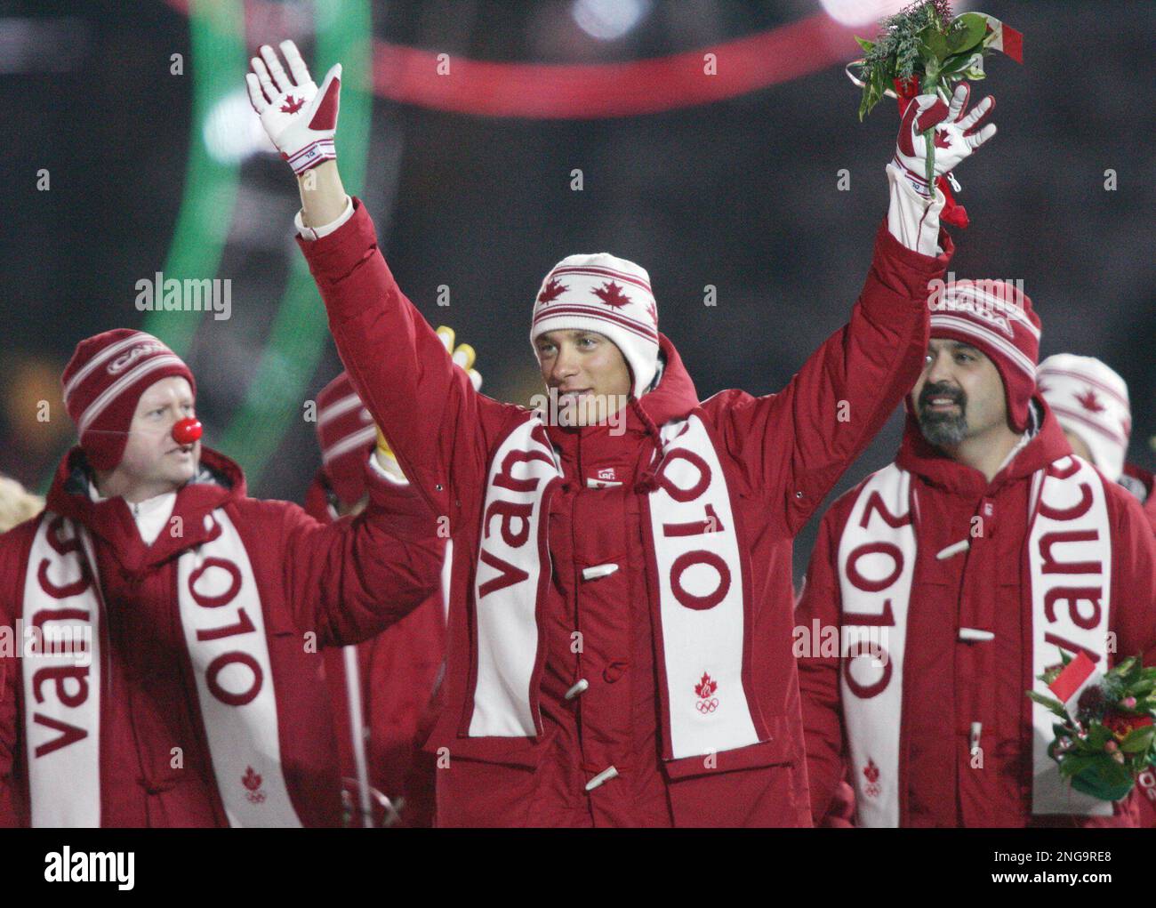 Canadian athletes arrive during the closing ceremonies of the Olympic ...