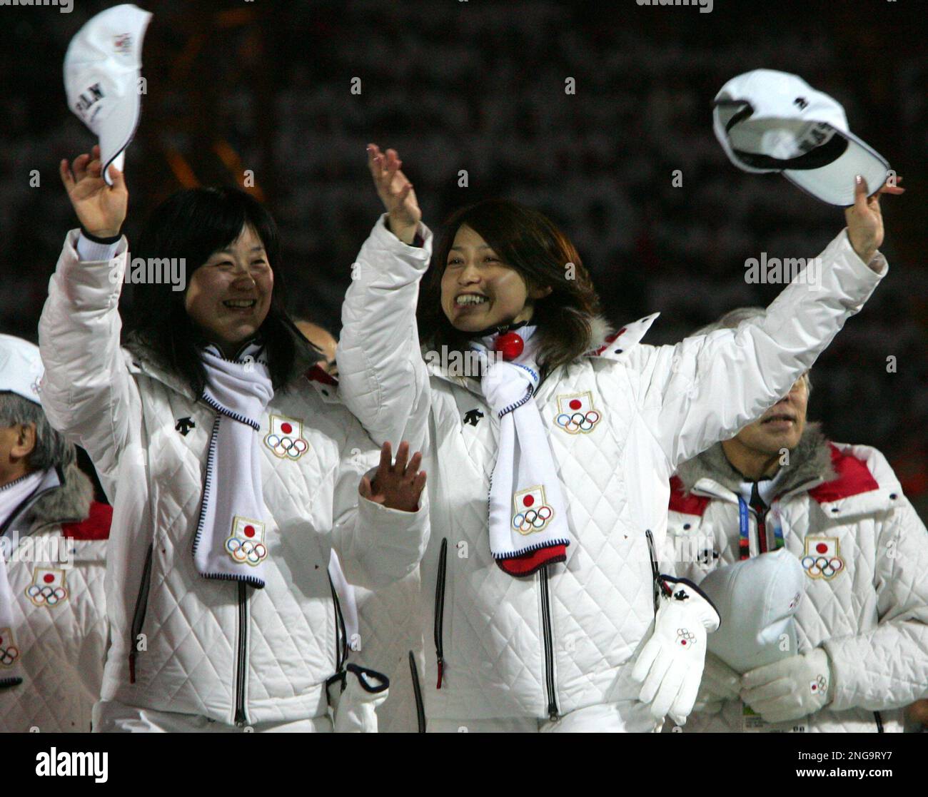 Japanese speedskaters Maki Tabata, left, and Tomomi Okazaki parade ...