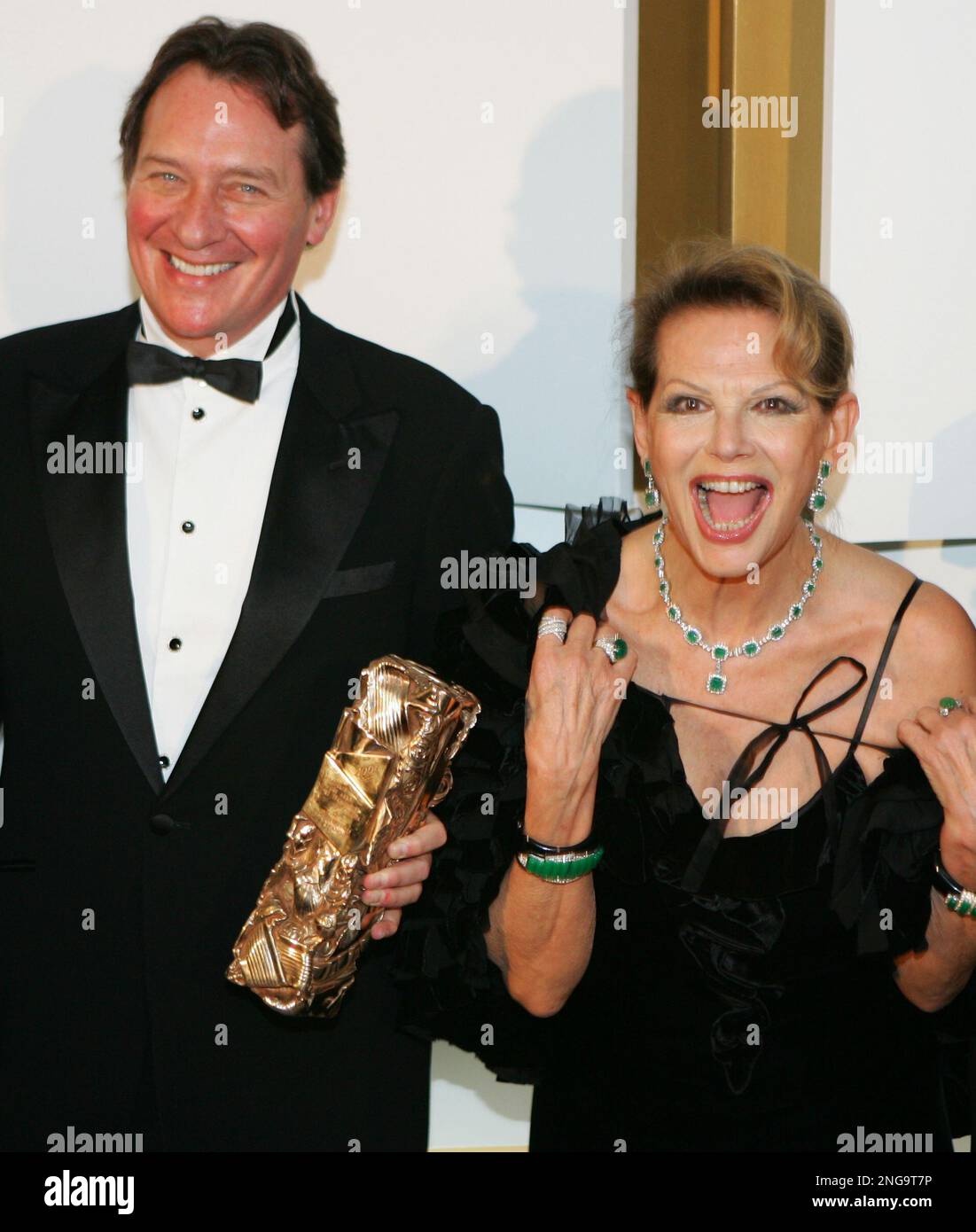 Italian movie star Claudia Cardinale clowns around as American producer ...