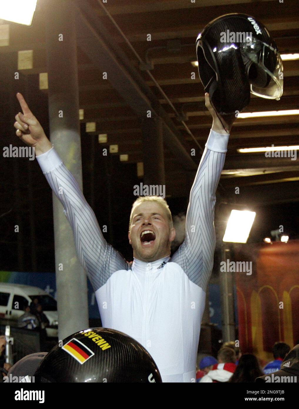 Germany's Andre Lange, pilot of bob Germany 1, celebrates after winning ...