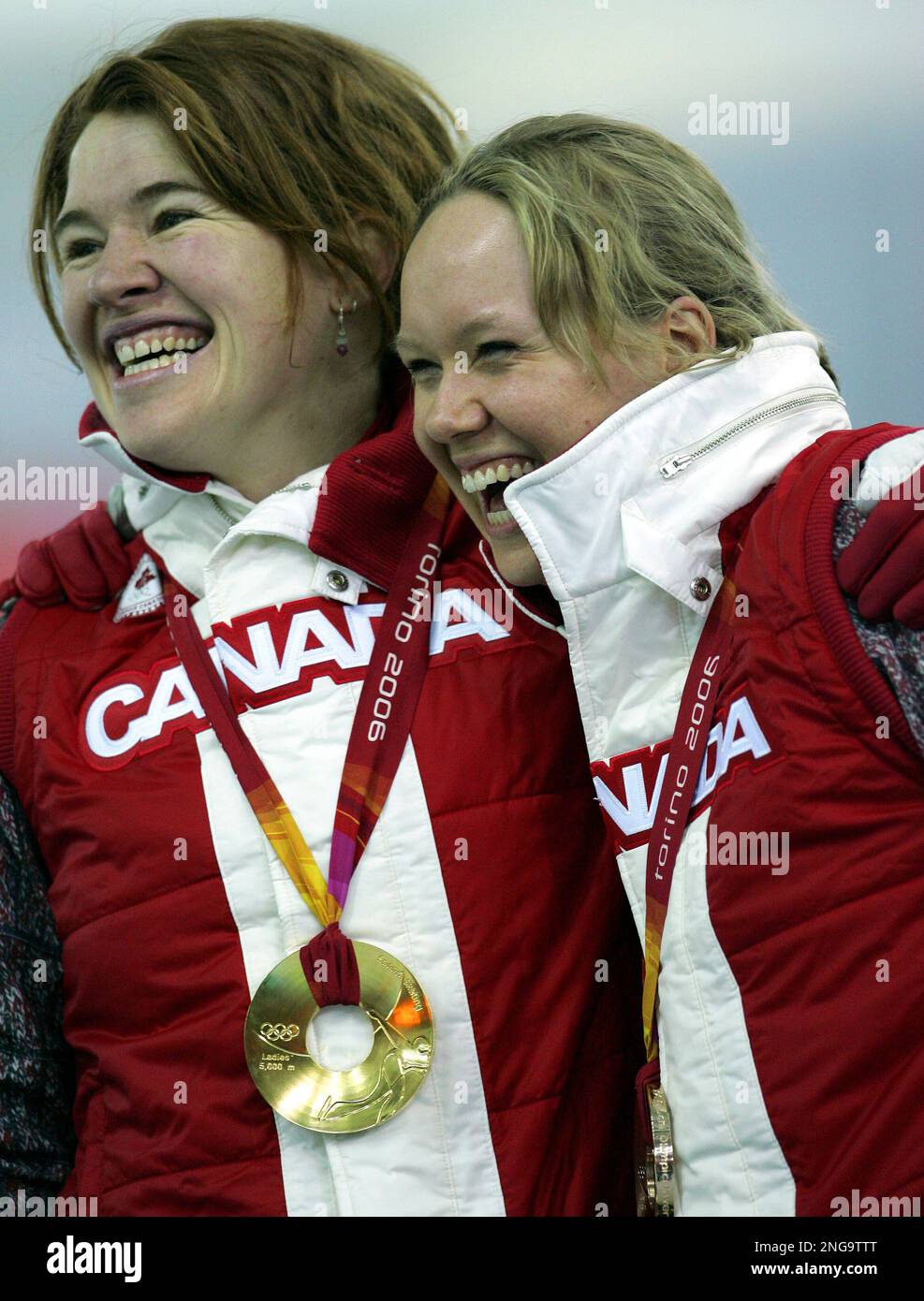 Gold medal winner Canada's Clara Hughes, left, and her compatriot ...