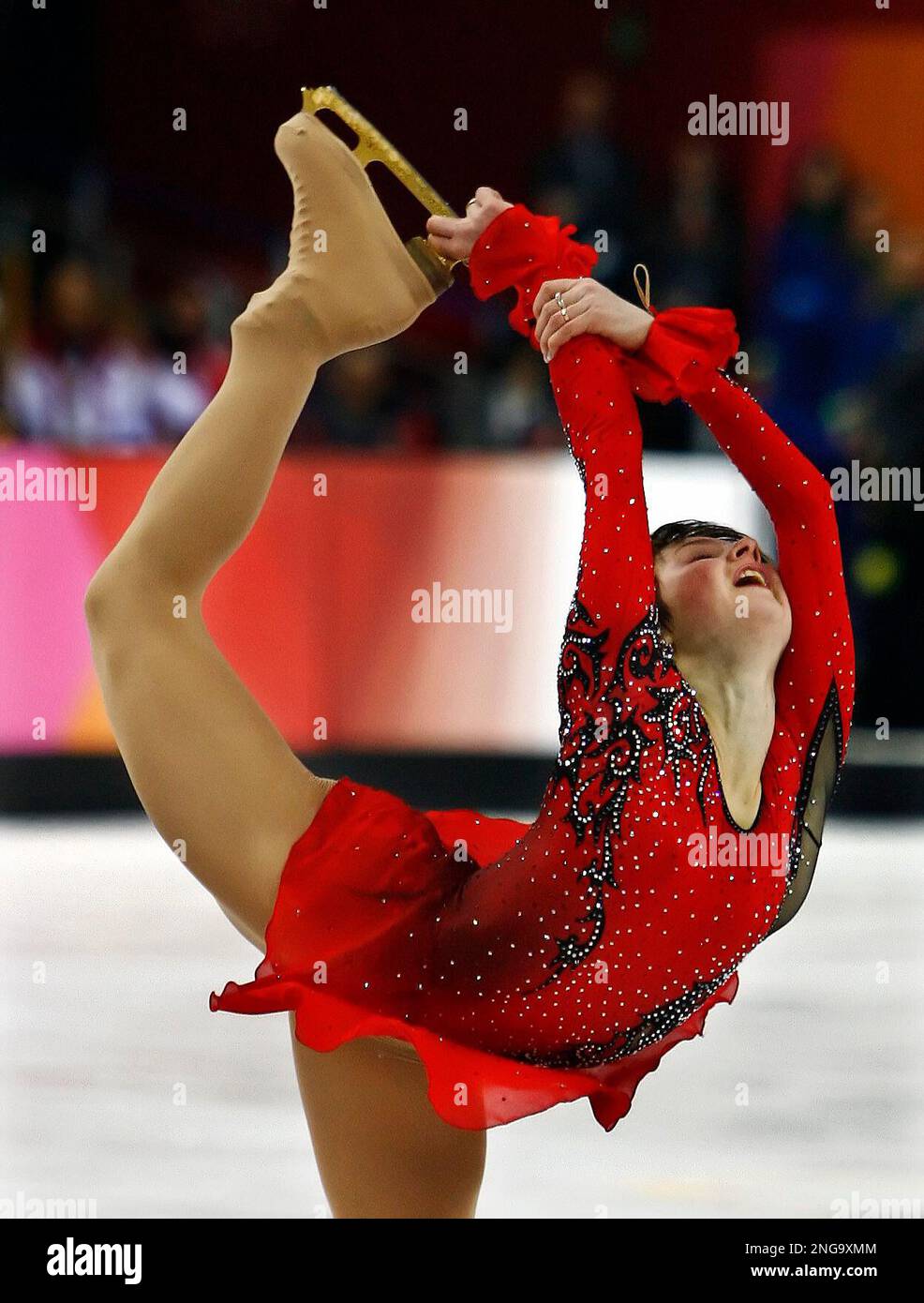 Bronze medalist Russia's Irina Slutskaya performs a Biellmann spin during the Women's Figure ...
