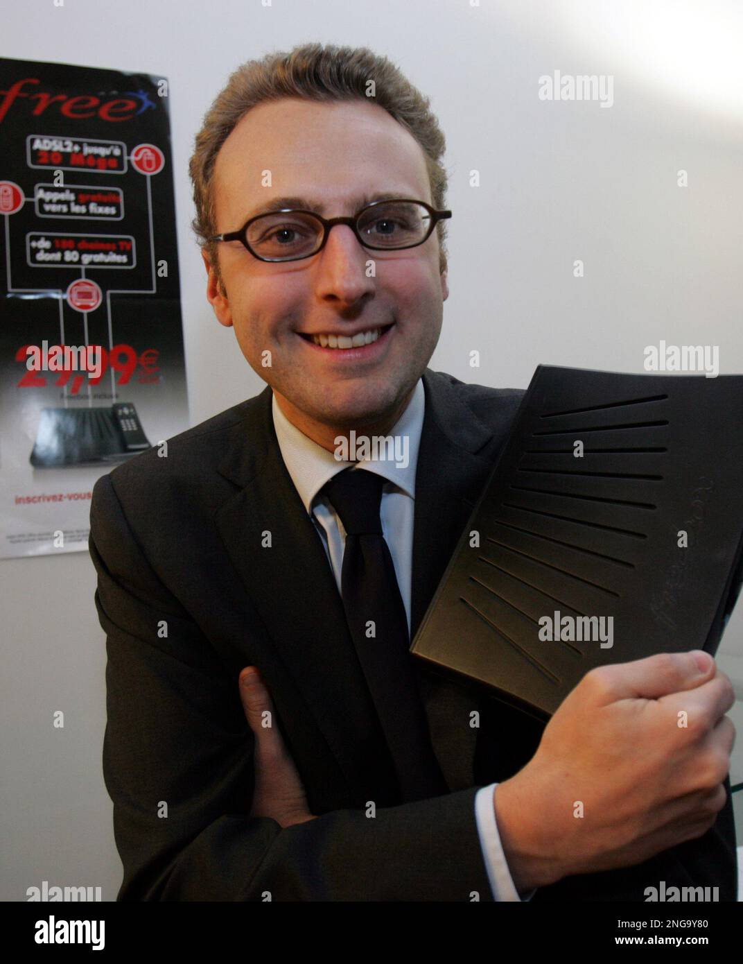 Iliad's Chief Financial Officer Olivier Rosenfeld shows the Freebox in ...