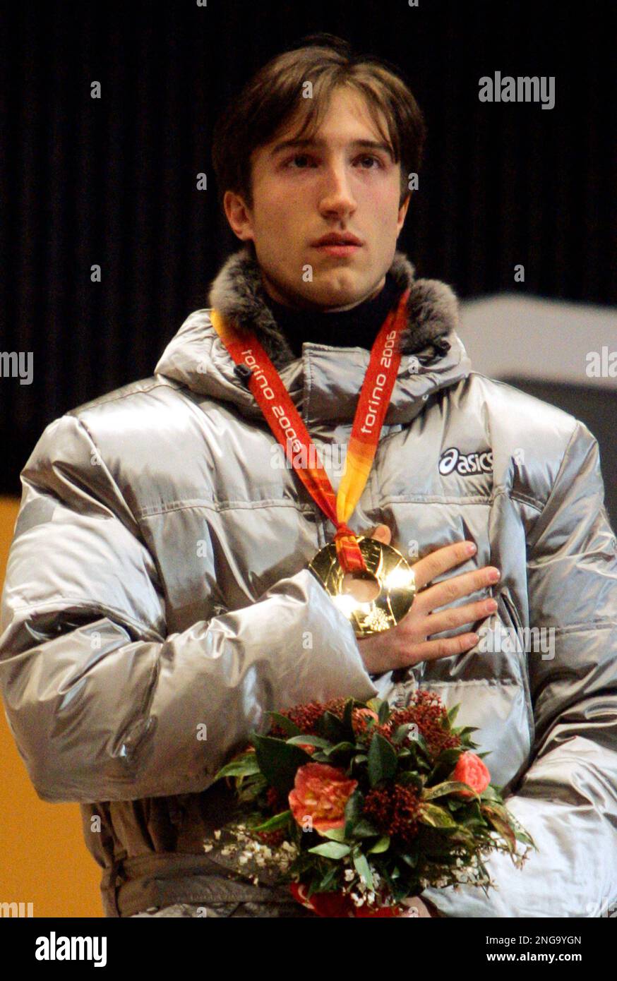 Italy's Enrico Fabris listens to the Italian national anthem with his ...