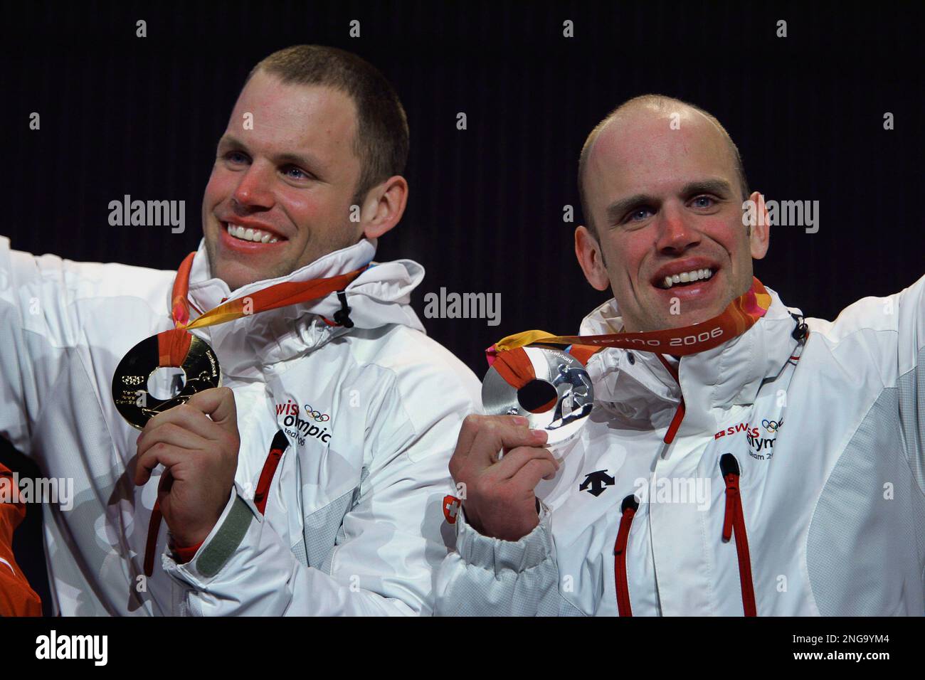 Gold medalist Philipp Schoch, left, of Switzerland celebrates with his ...