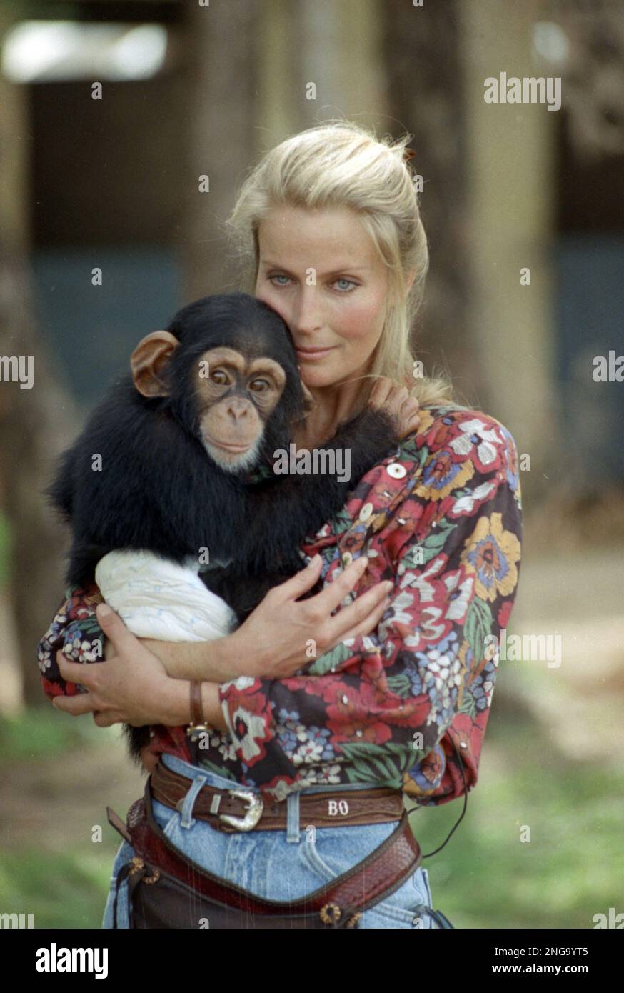 Actress and model Bo Derek, shown Sept. 11, 1992, comforts a baby ...