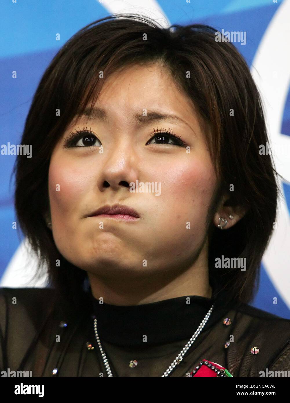 Japan's Miki Ando grimaces as she sees her scores following her routine ...