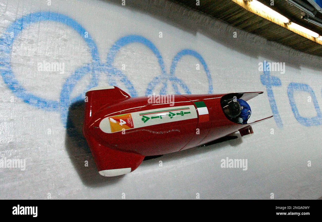 Italy-1, piloted by Gerda Weissensteiner, navigates a curve on its way ...