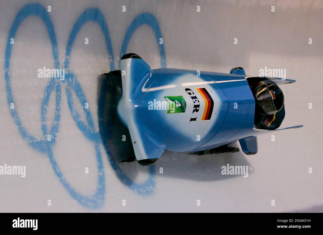 Germany's GER-1 bobsled piloted by Andre Lange turns through curve five ...