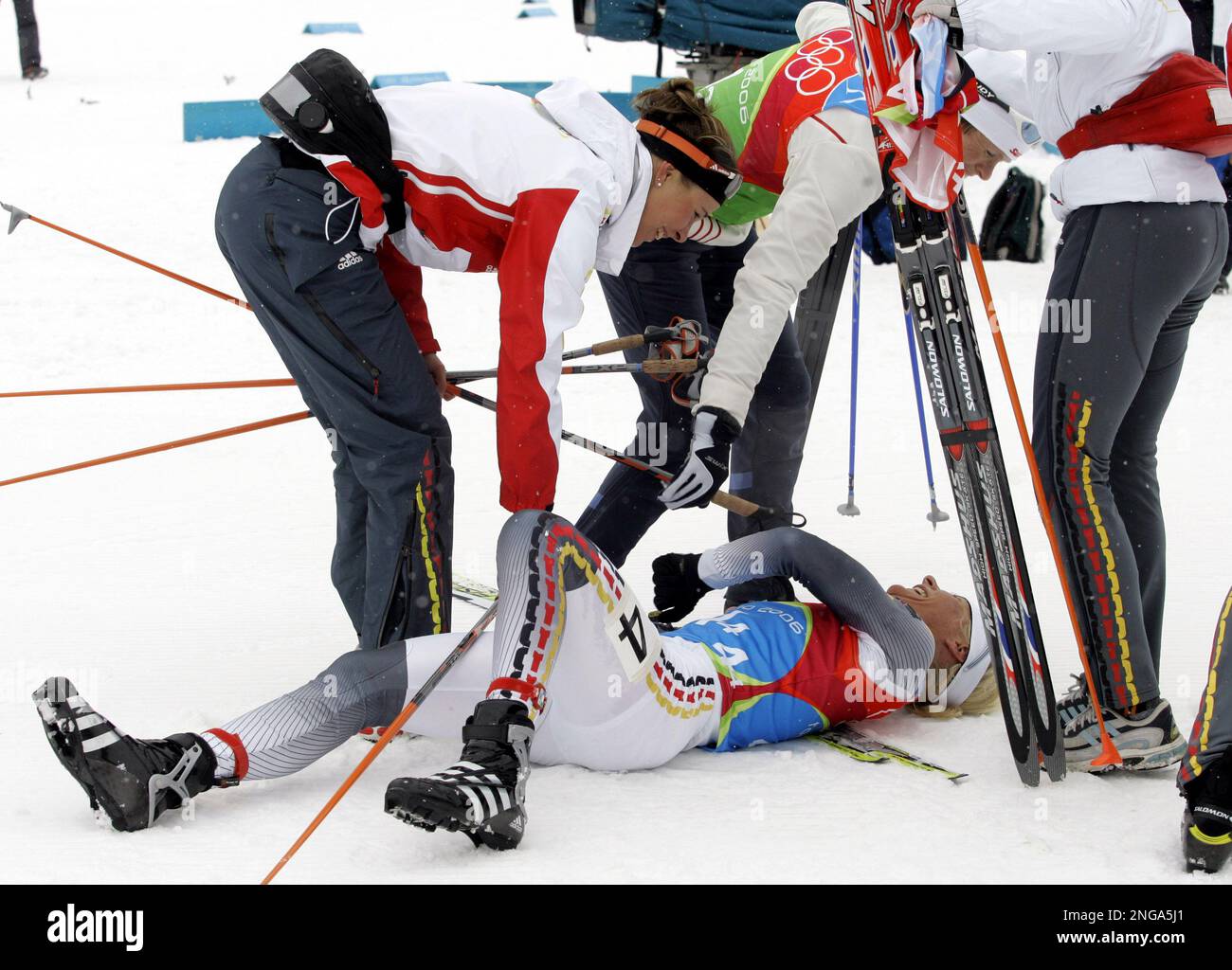 Germany's Claudia Kuenzel, bottom, is congratulated by her teammates ...
