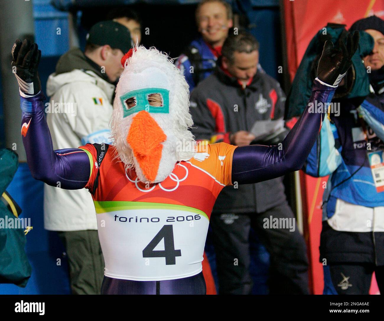 France's Phillippe Cavoret wears a chicken mask after finishing his final run in Men's Skeleton ...