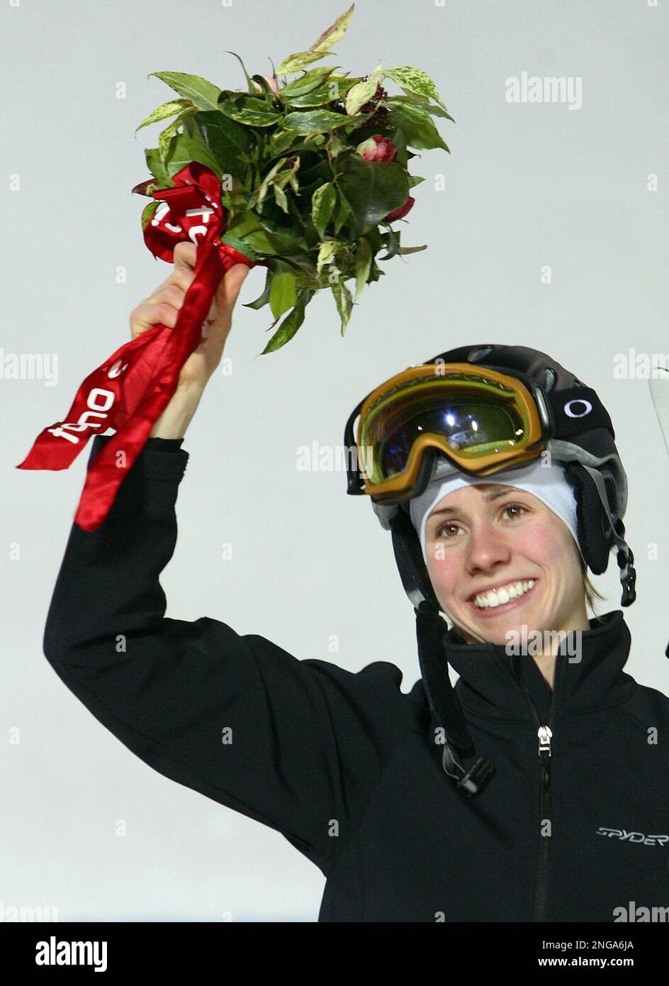 Jennifer Heil of Spruce Grove, Alta., waves from the victory podium ...