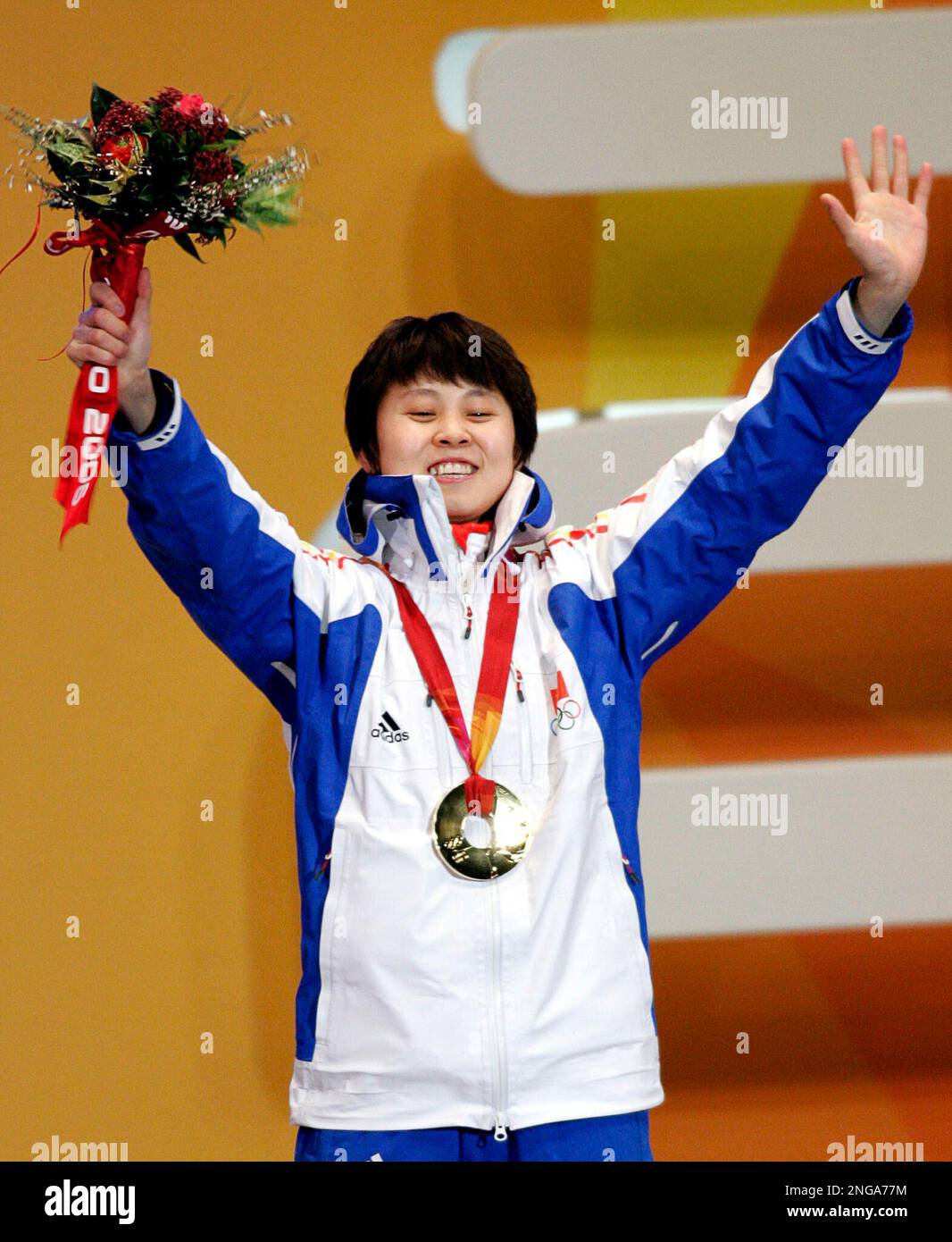 China's Wang Meng celebrates her gold medal during the medal ceremony ...