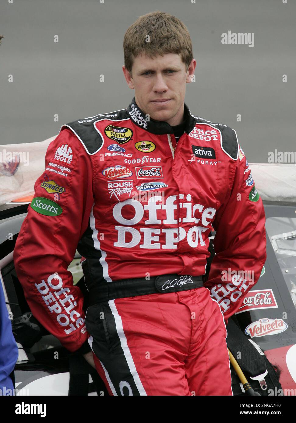 NASCAR driver Carl Edwards leans on his car prior to the start of the ...