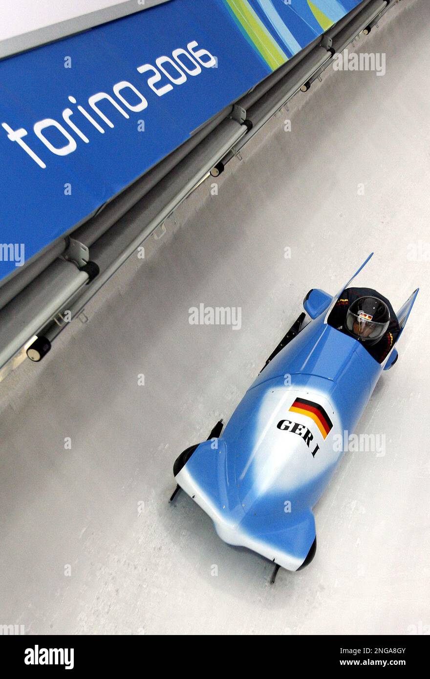 German pilot Andre Lange slides down the track during an Olympic Men's ...