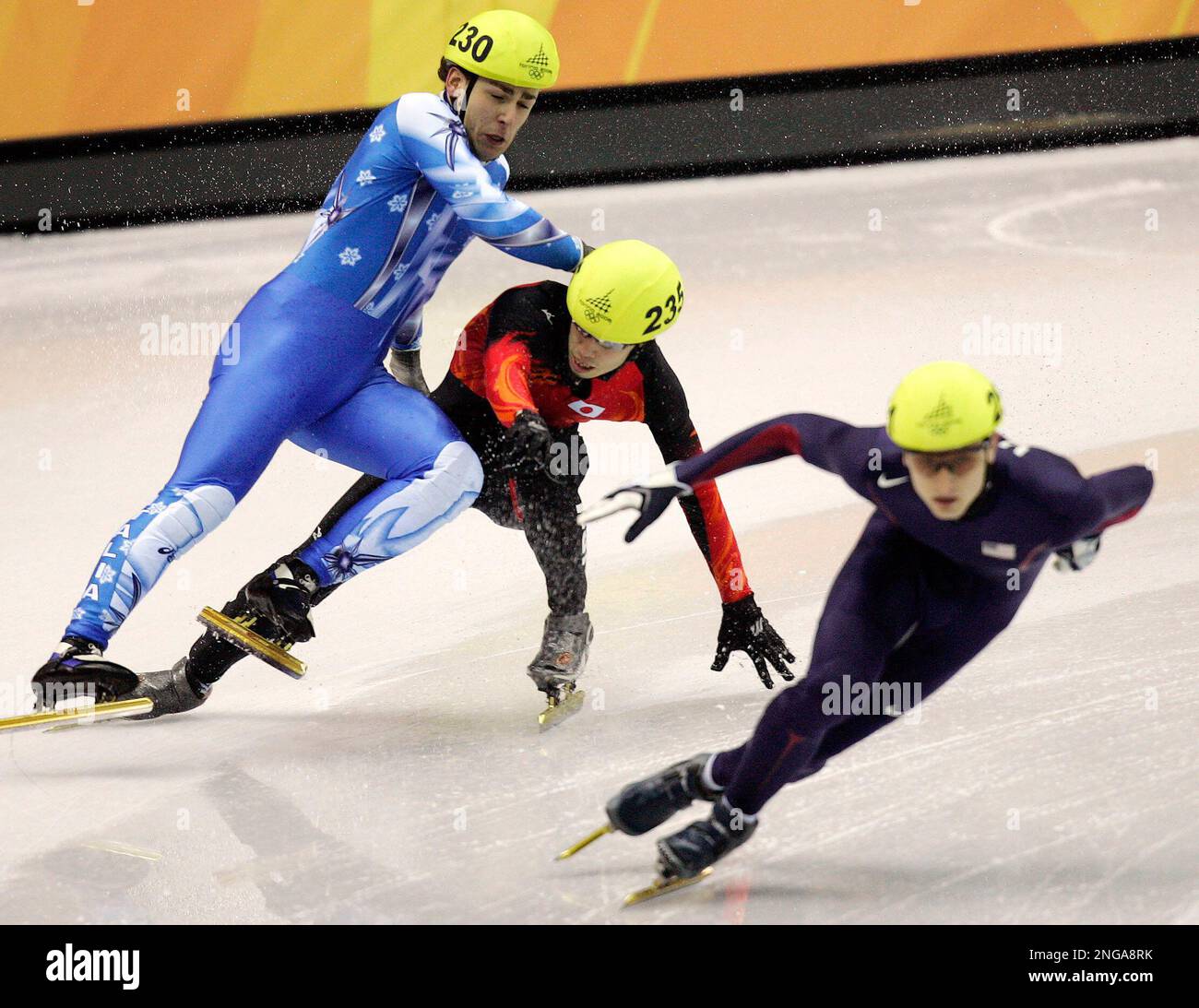 Japan's Takahiro Fujimoto (235) crashes into Yuri Confortola (230 ...