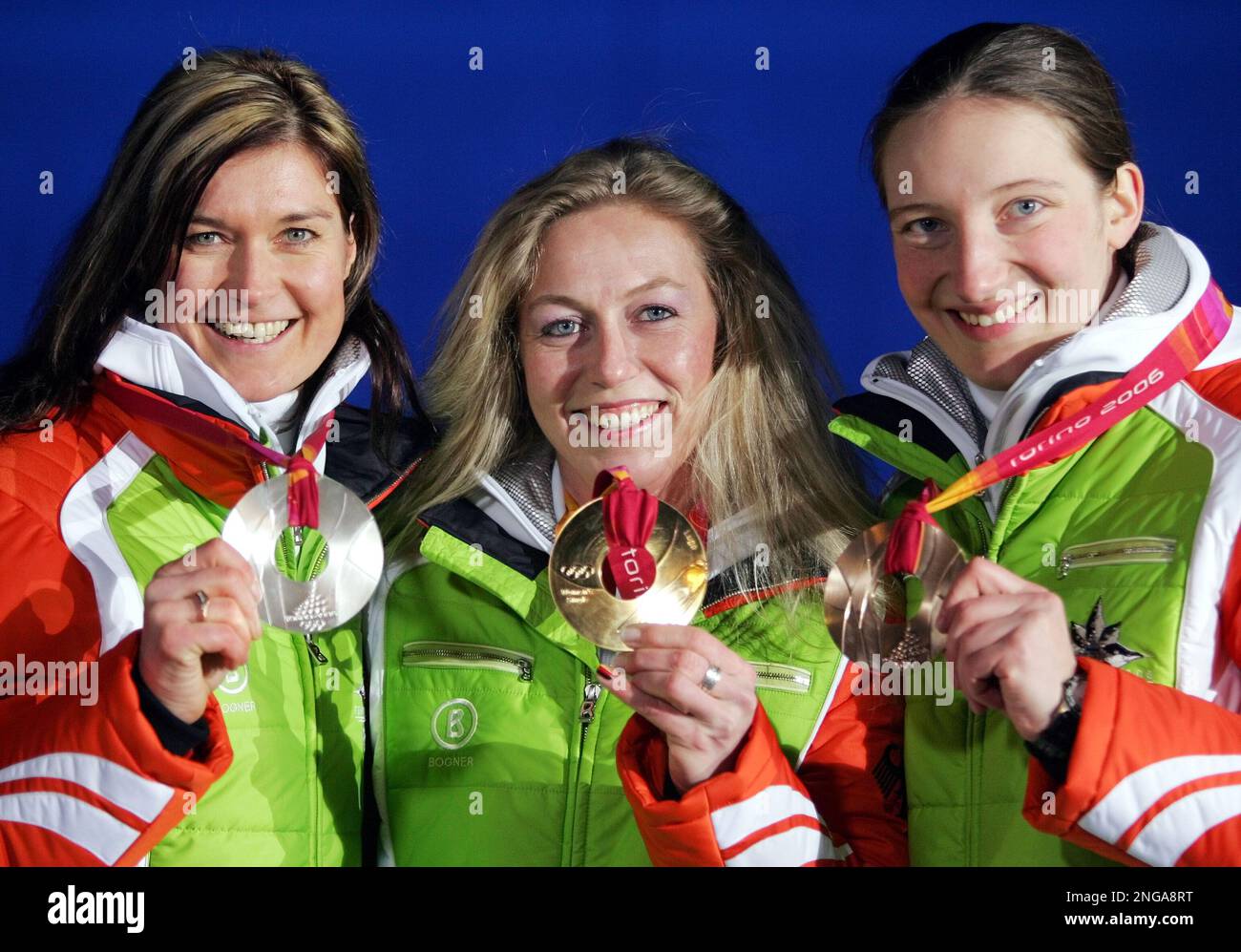 Germany's Sylke Otto, center, celebrates her luge gold medal with ...