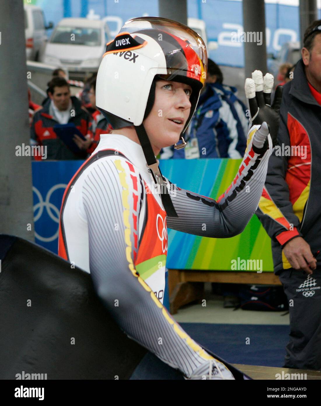 Germany's Sylke Otto waves to the crowd at the finish of her third run ...