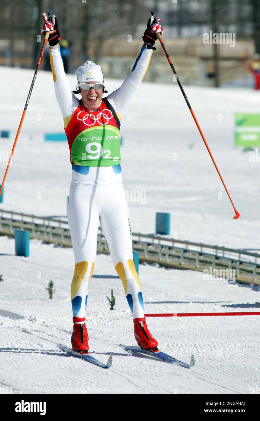 Sweden's Lina Andersson celebrates as she crosses the finish line to ...