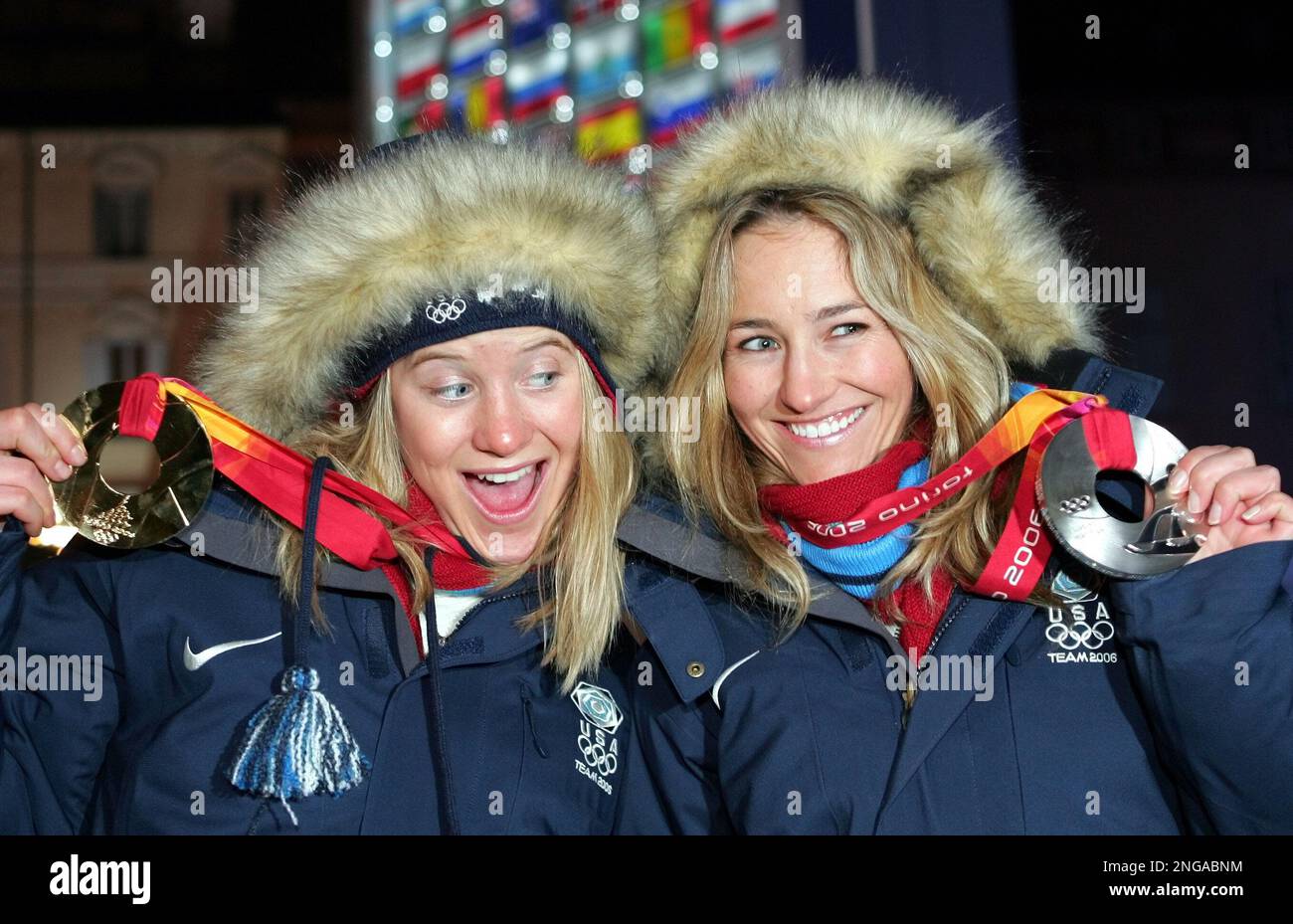 United States snowboarder Hannah Teter, left, poses with her gold medal ...