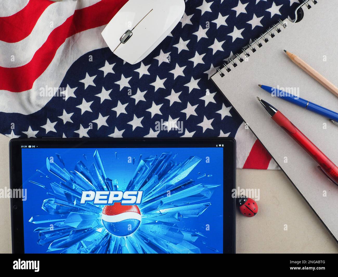 In this photo illustration, Pepsi logo seen displayed on a tablet with ...