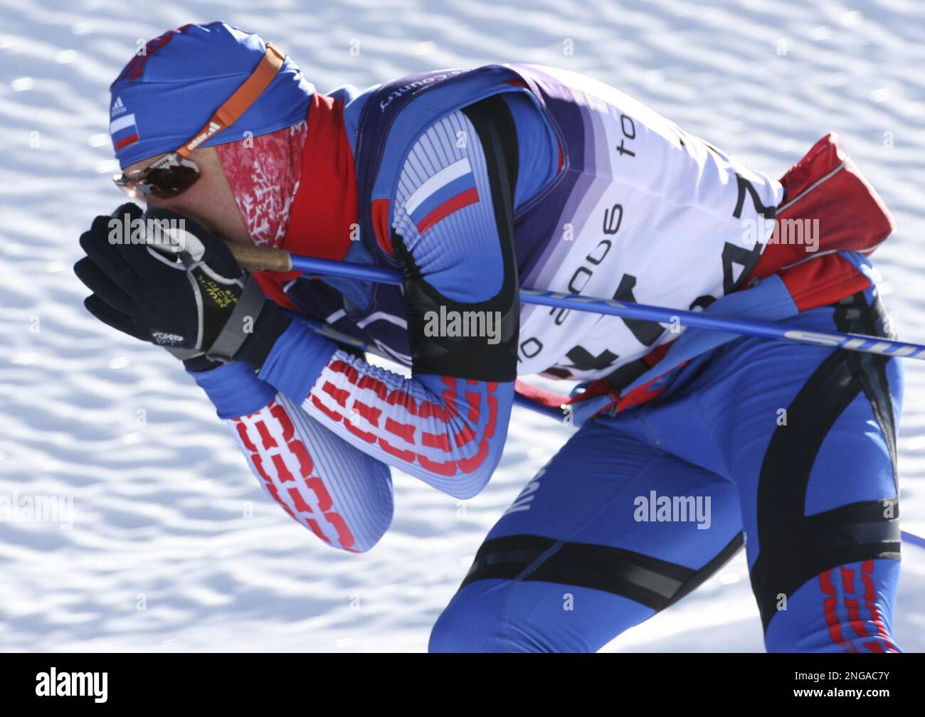 Russia's Nikolai Pankratov covers his face as he skis downhill during a ...