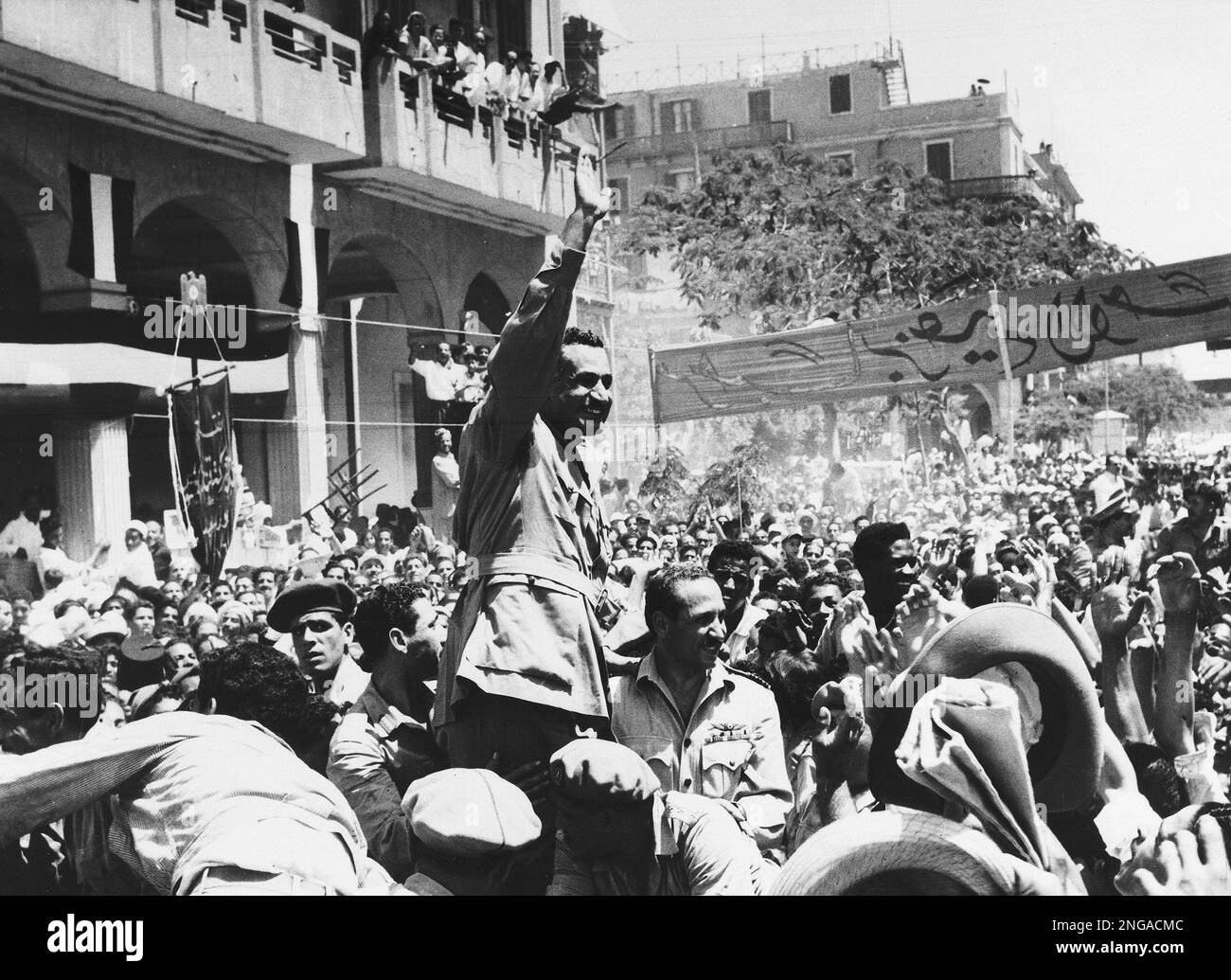 Egyptian President Gamal Abdel Nasser acknowledges the acclaim of ...
