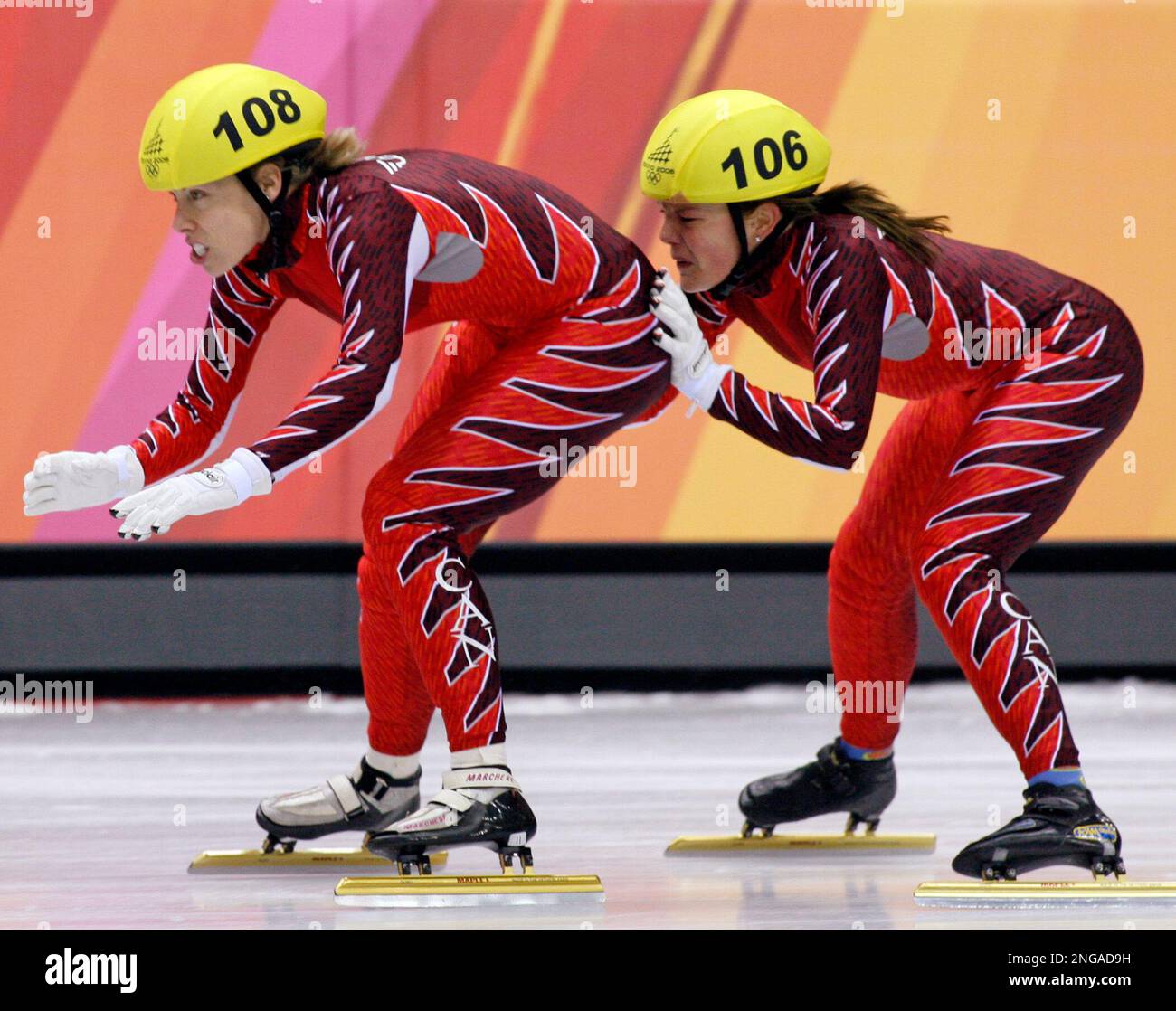 Canada's Tania Vicent, left, is pushed by Amanda Overland in the women ...