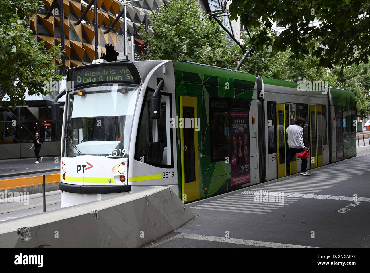 Yarra Trams D-class, or Combino, tram at a stop on Swanston St, as a ...