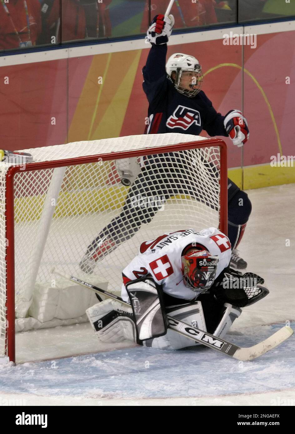 The United States' Tricia Dunn Luoma, top, celebrates after scoring ...