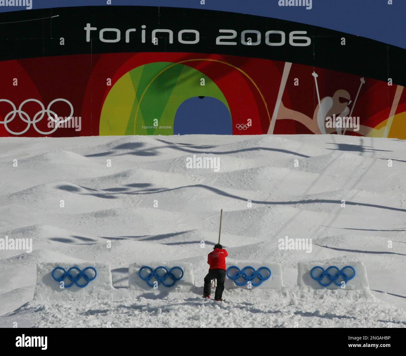A worker prepares the track ahead of the Olympic Women's Moguls ...