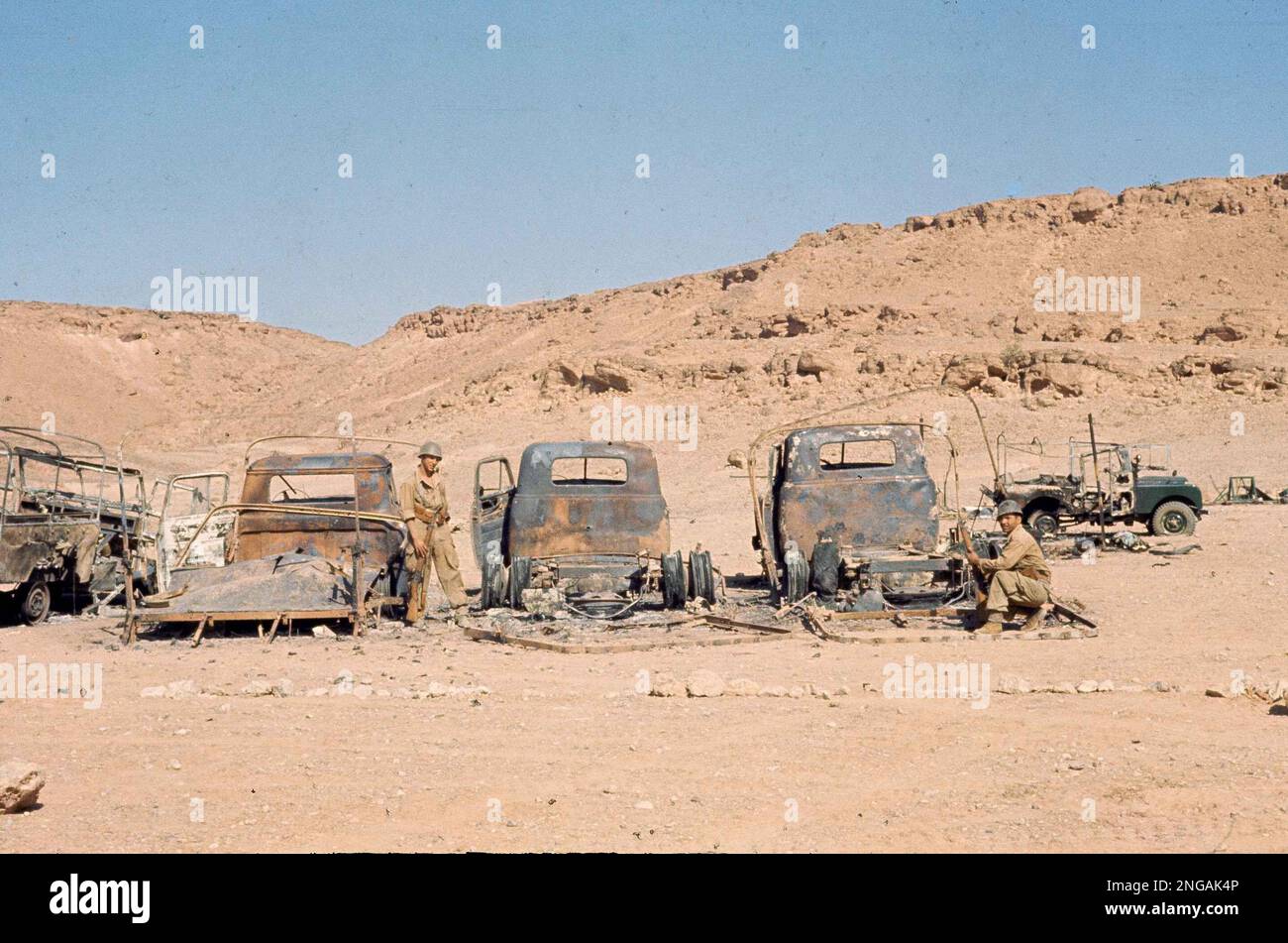 Wrecked military vehicles are seen at the Hassi Beida post in the ...