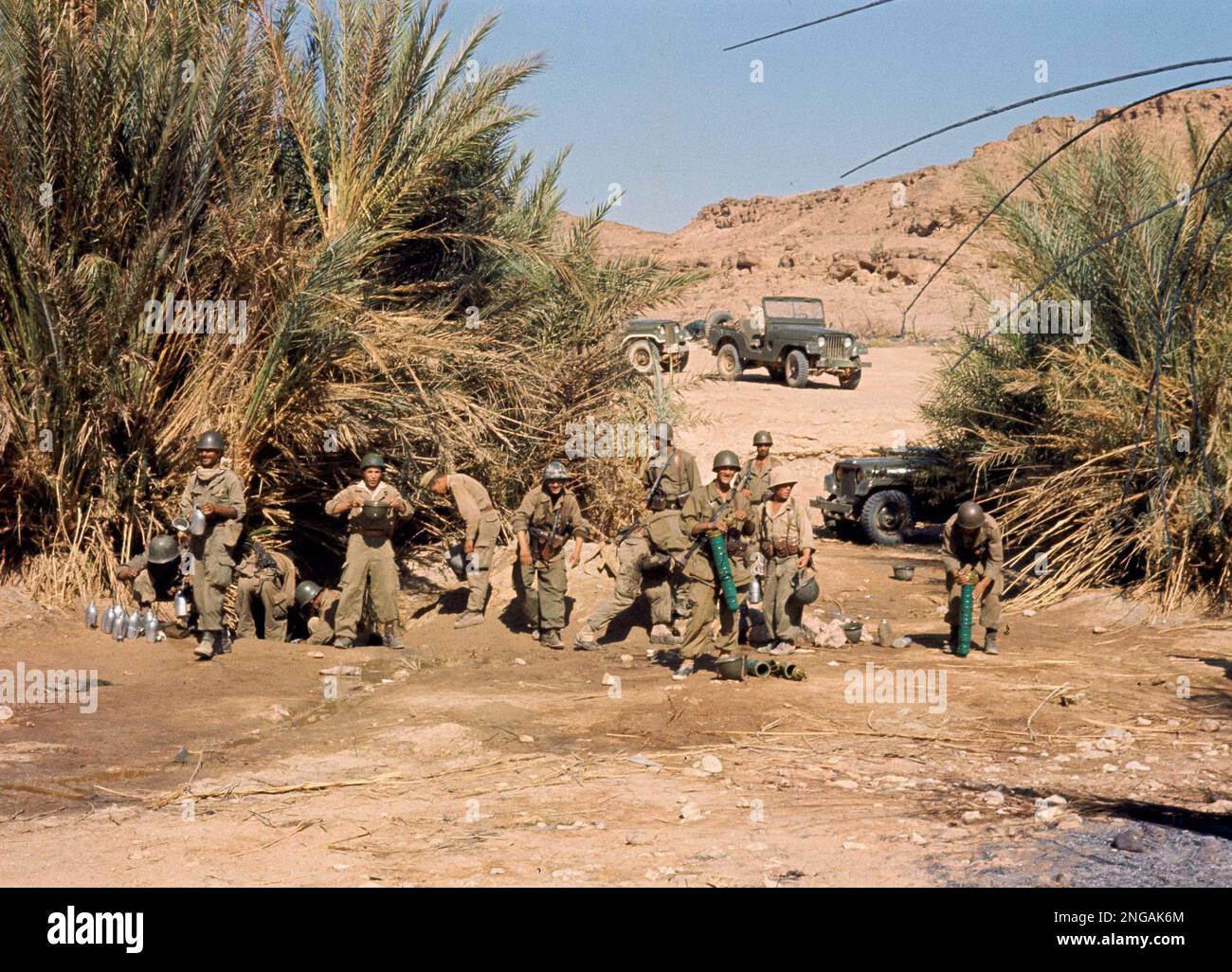 Soldiers rest and drink water at the Hassi Beida post in the disputed ...