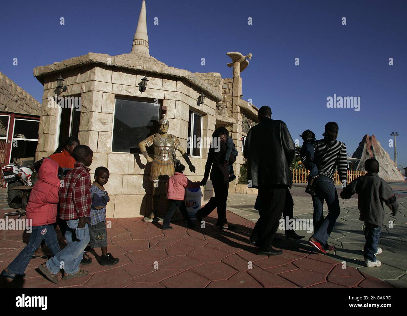 A family is seen as they arrive inside the games park, Magic Land, at ...