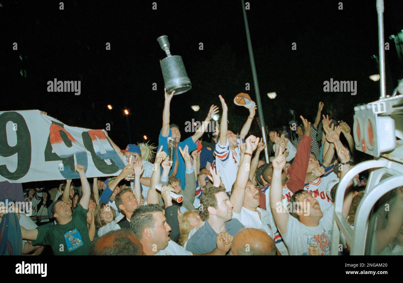 New York Rangers fans are pictured outside in the streets, celebrating ...